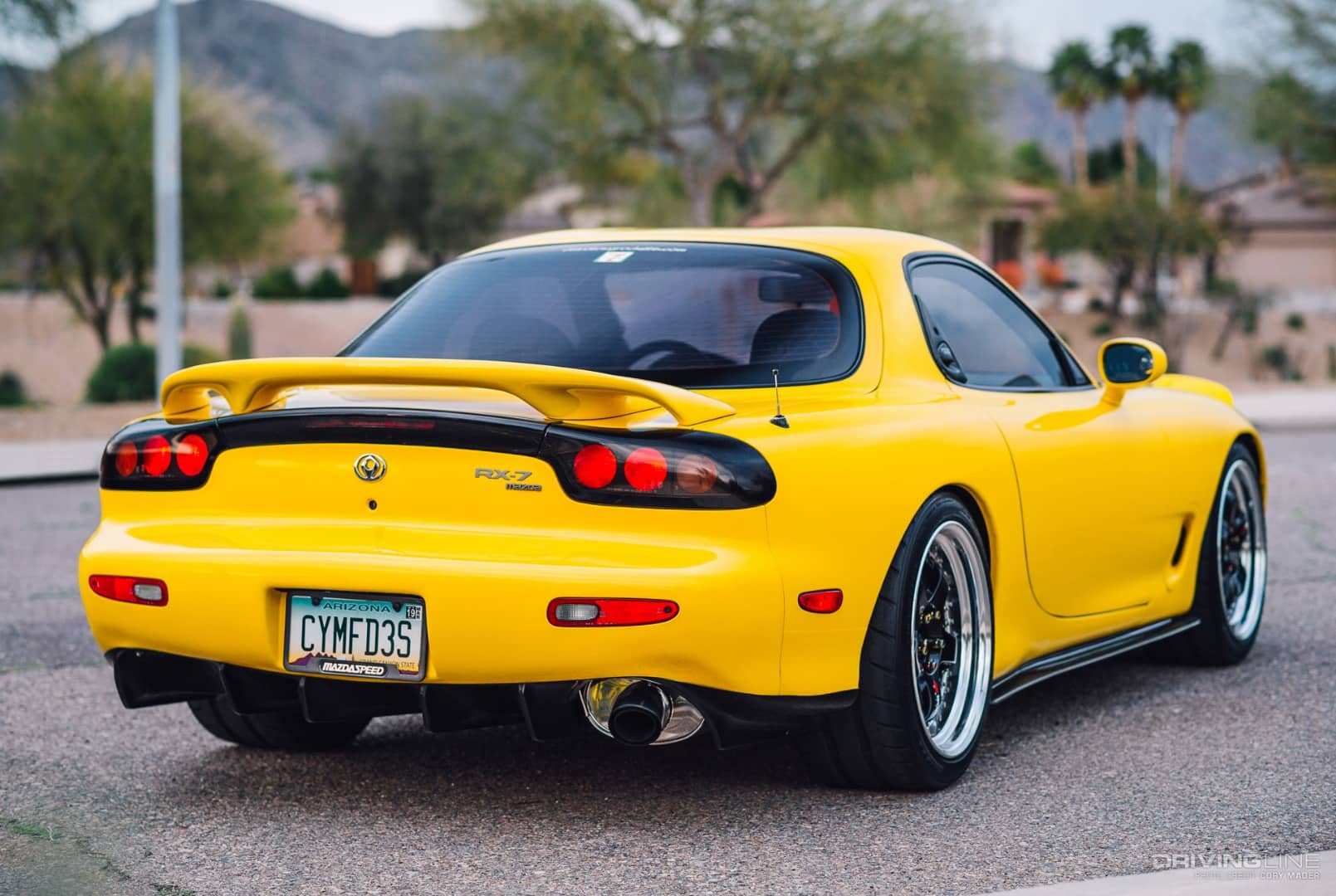 Tim Eull's Competition Yellow Mica Mazda RX-7 R1 | DrivingLine